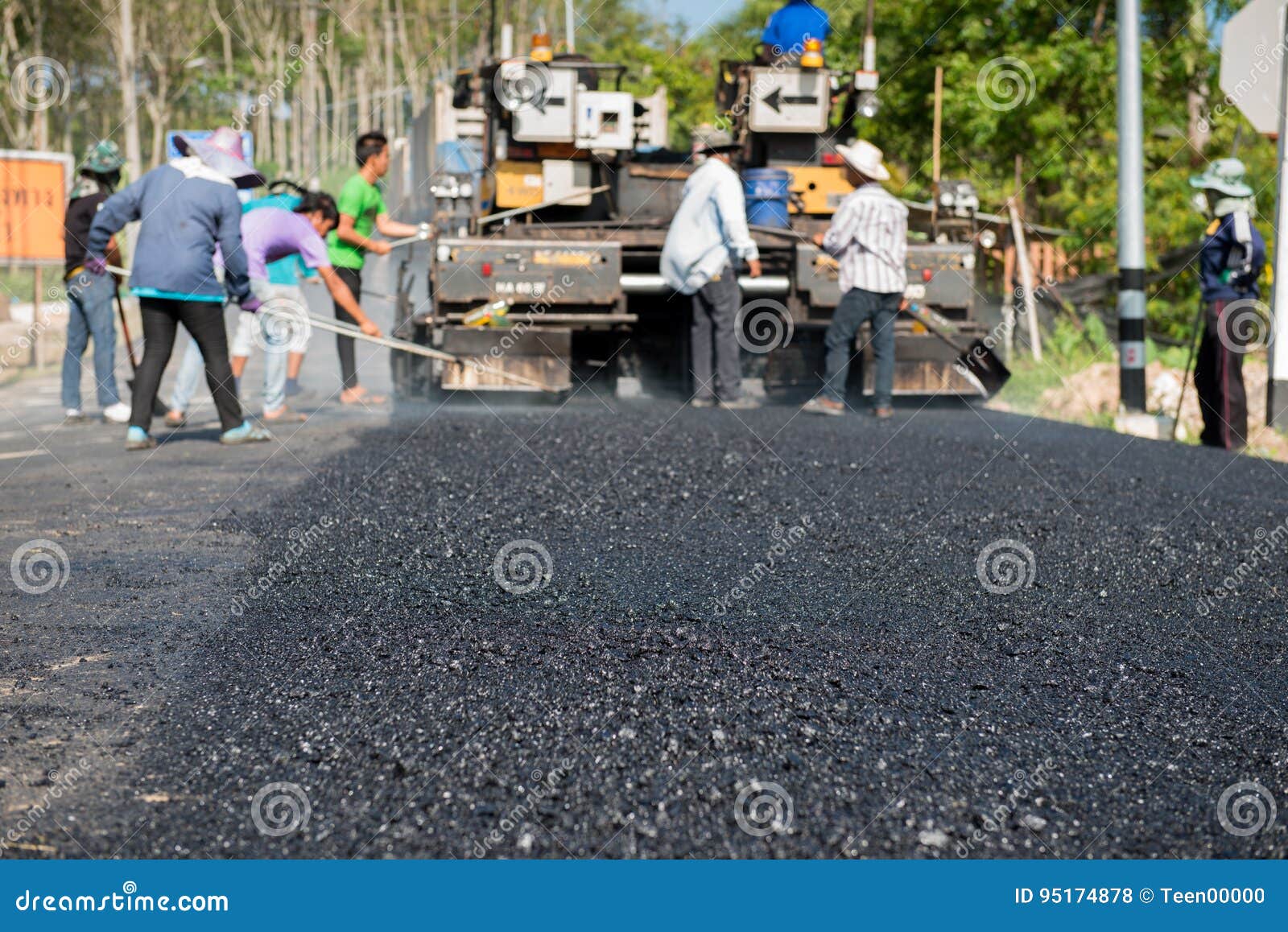 Worker Operating Asphalt Paver Machine during Road Construction ...