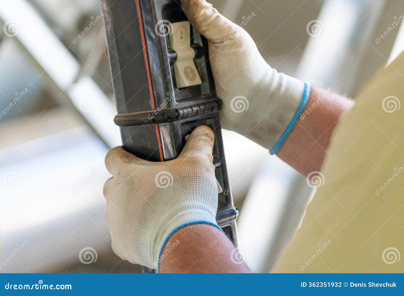 Worker Operating a Hoist Crane Control Panel with Protective Gloves in ...