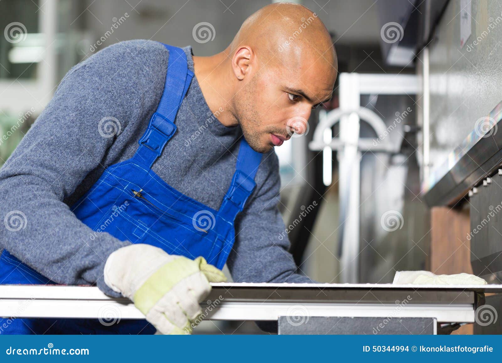 Worker Operating Machine for Bending Sheet Metal Stock Photo - Image of ...