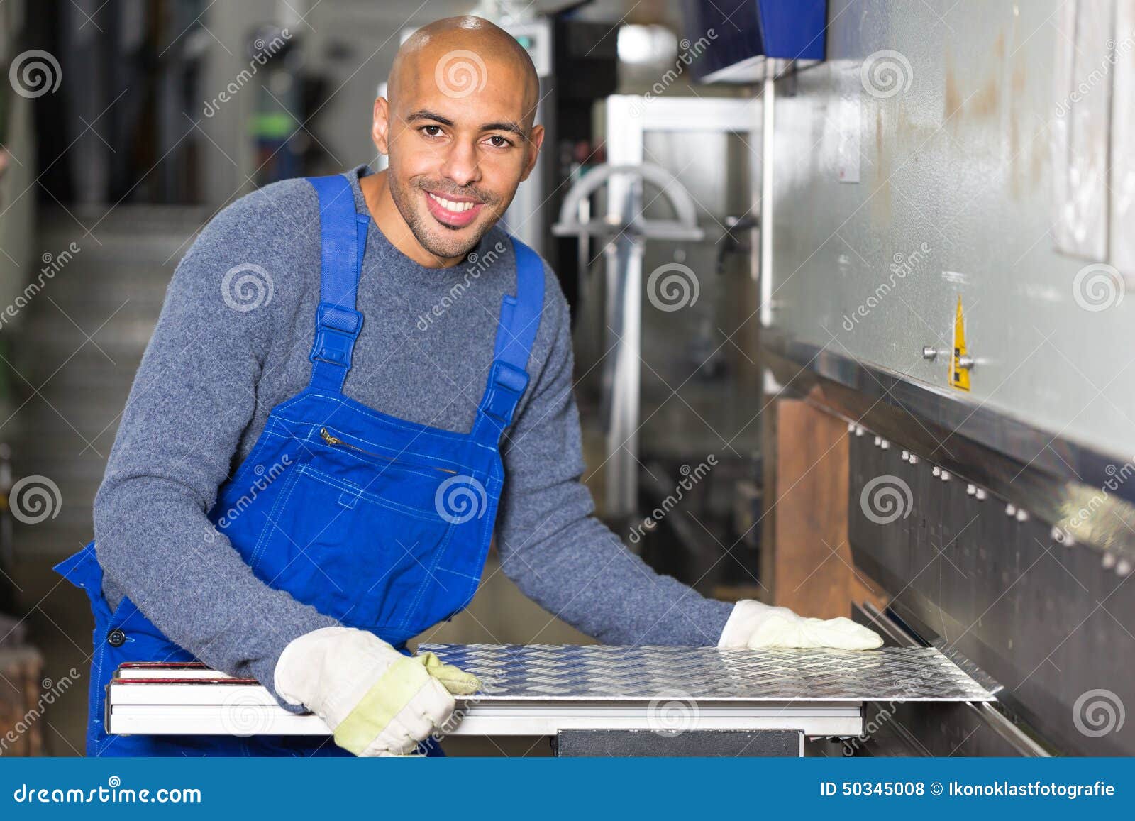 Worker Operating Machine for Bending Sheet Metal Stock Photo - Image of ...