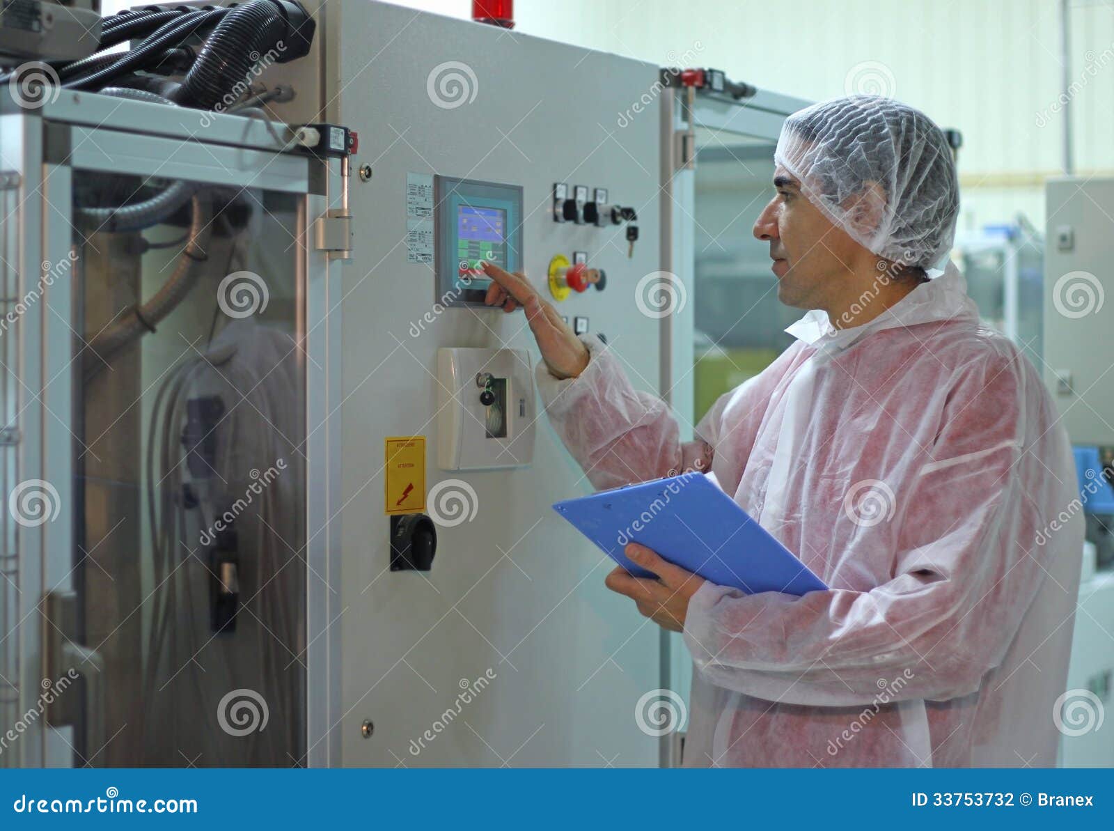 Worker operating a machine stock photo. Image of industrial - 33753732