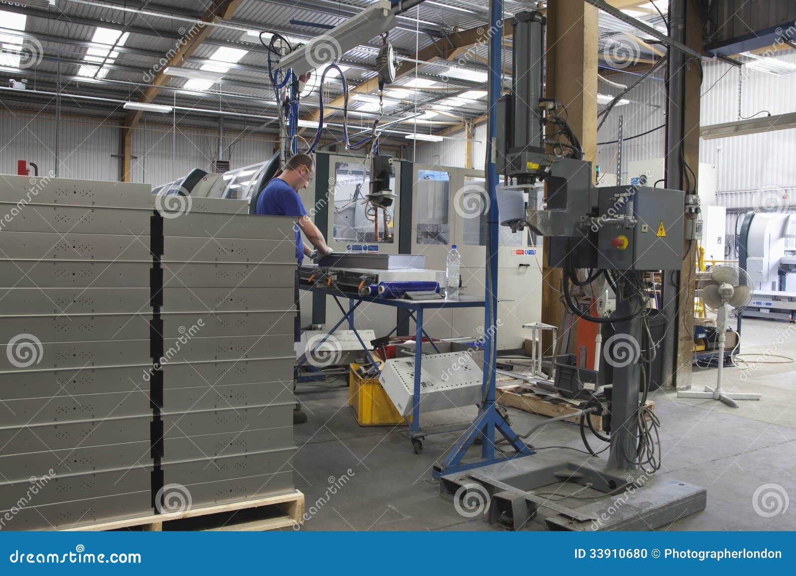 Worker Operating Machine stock photo. Image of line, horizontal - 33910680