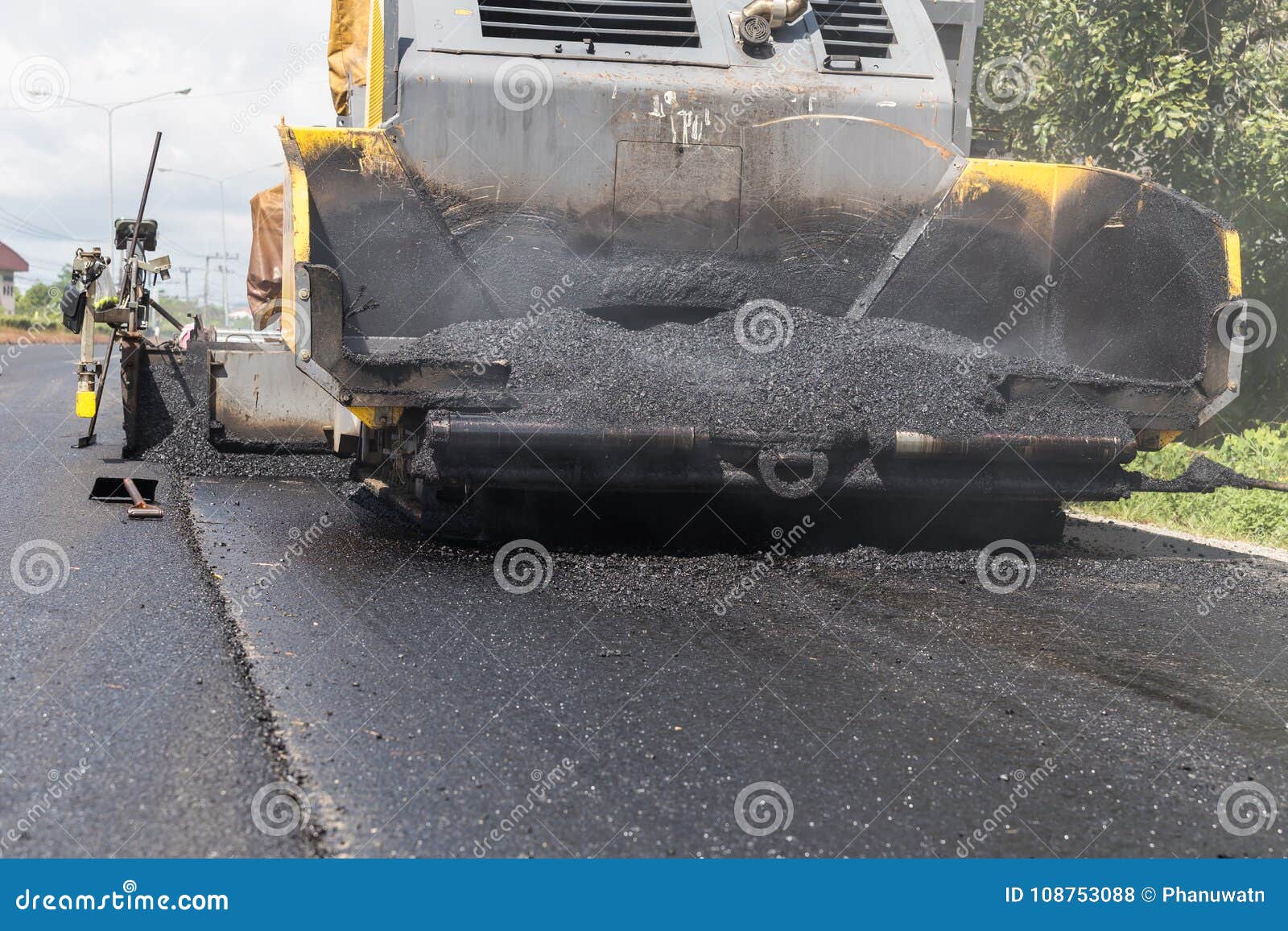 Worker Operating the Process of Building New Asphalt Road on the Stock ...