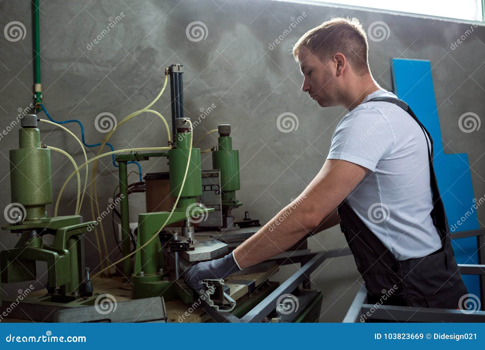 Worker Operating Welding Machine In Factory. Stock Image - Image of ...