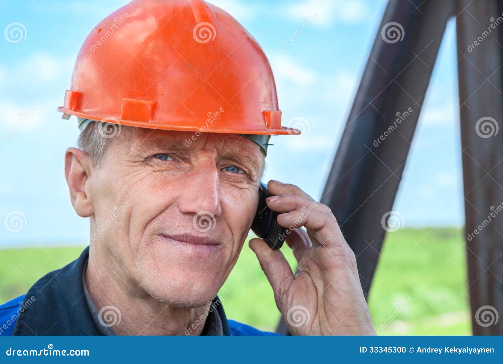 Worker in Orange Hardhat Calling on the Phone Stock Photo - Image of ...