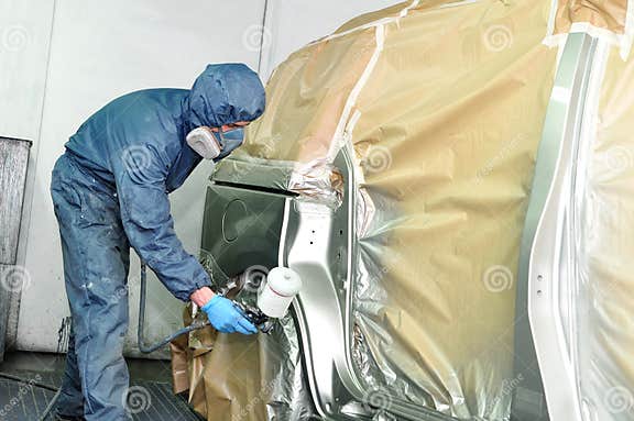 Worker painting a car. stock image. Image of lacquer - 34931643