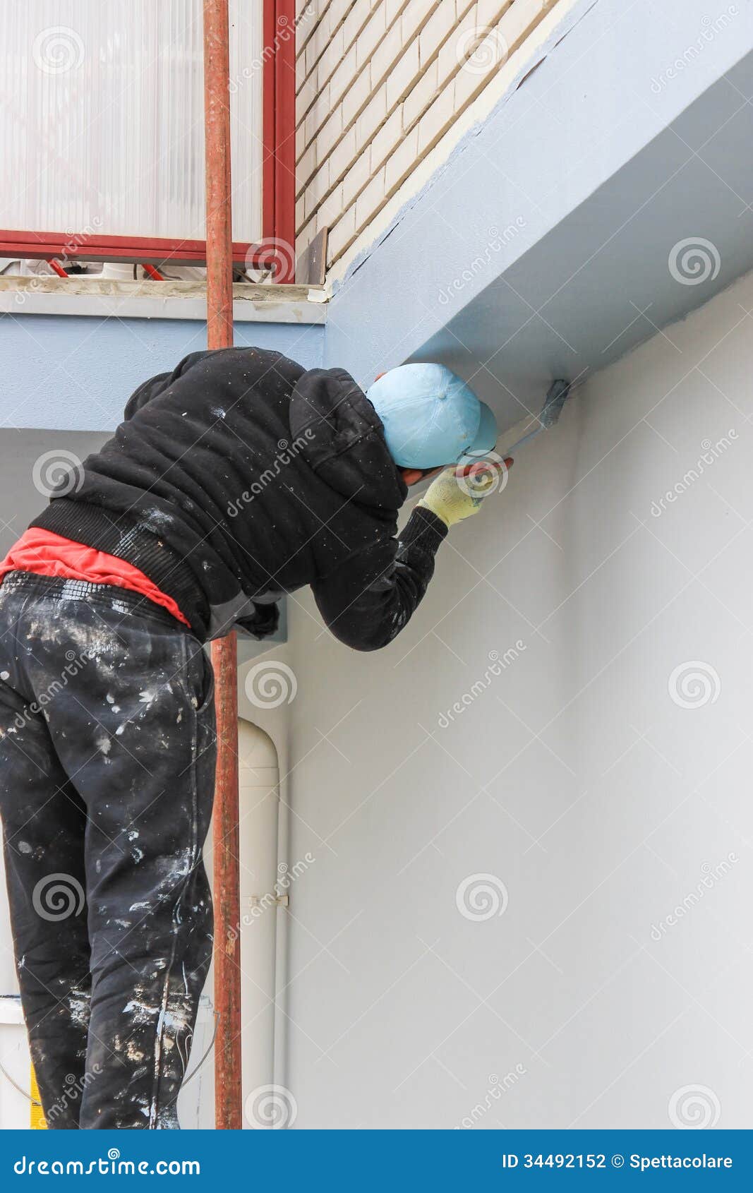 Worker painting facade stock photo. Image of male, improvement - 34492152