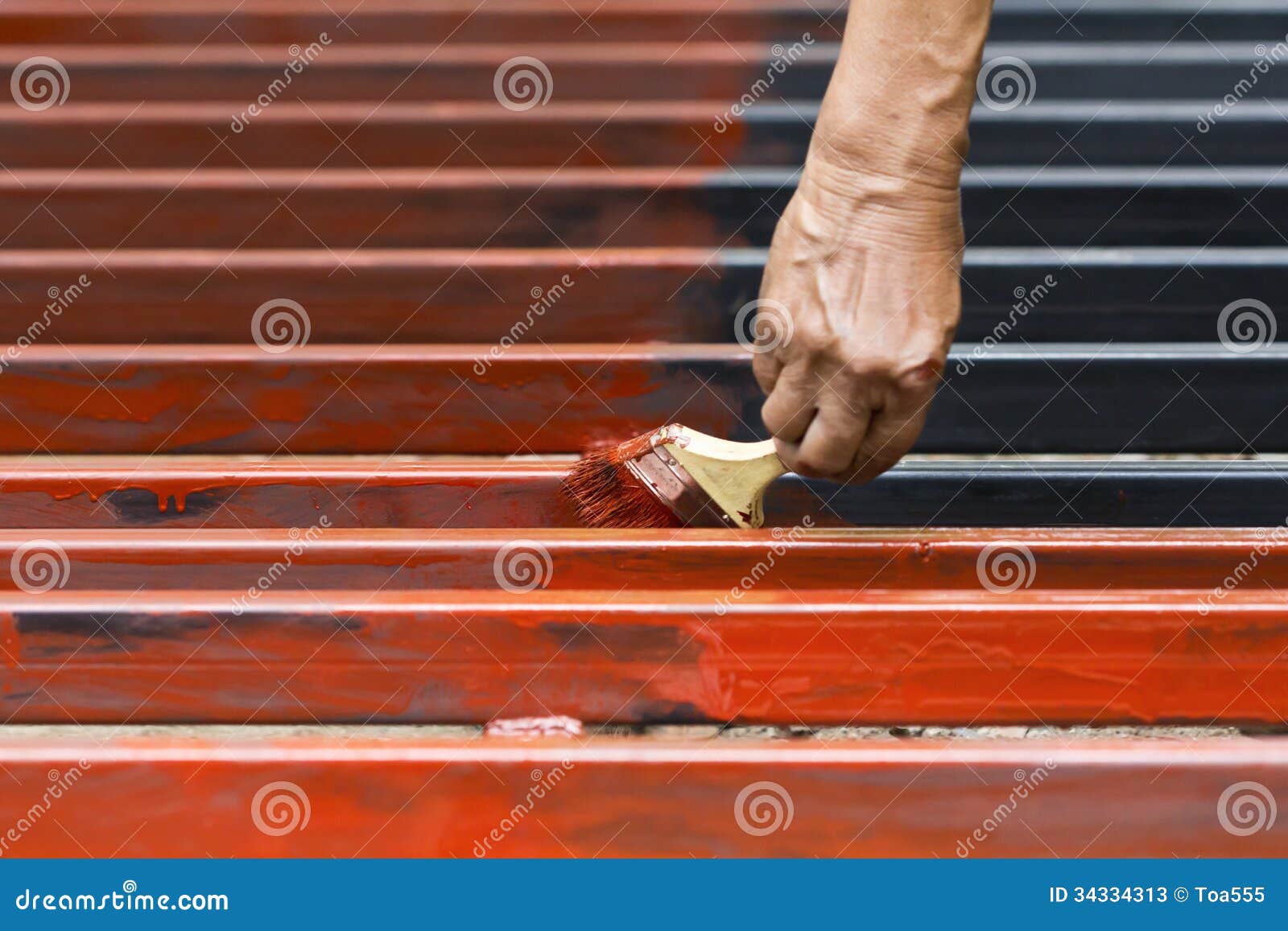 Worker painting steel bars stock image. Image of repair - 34334313