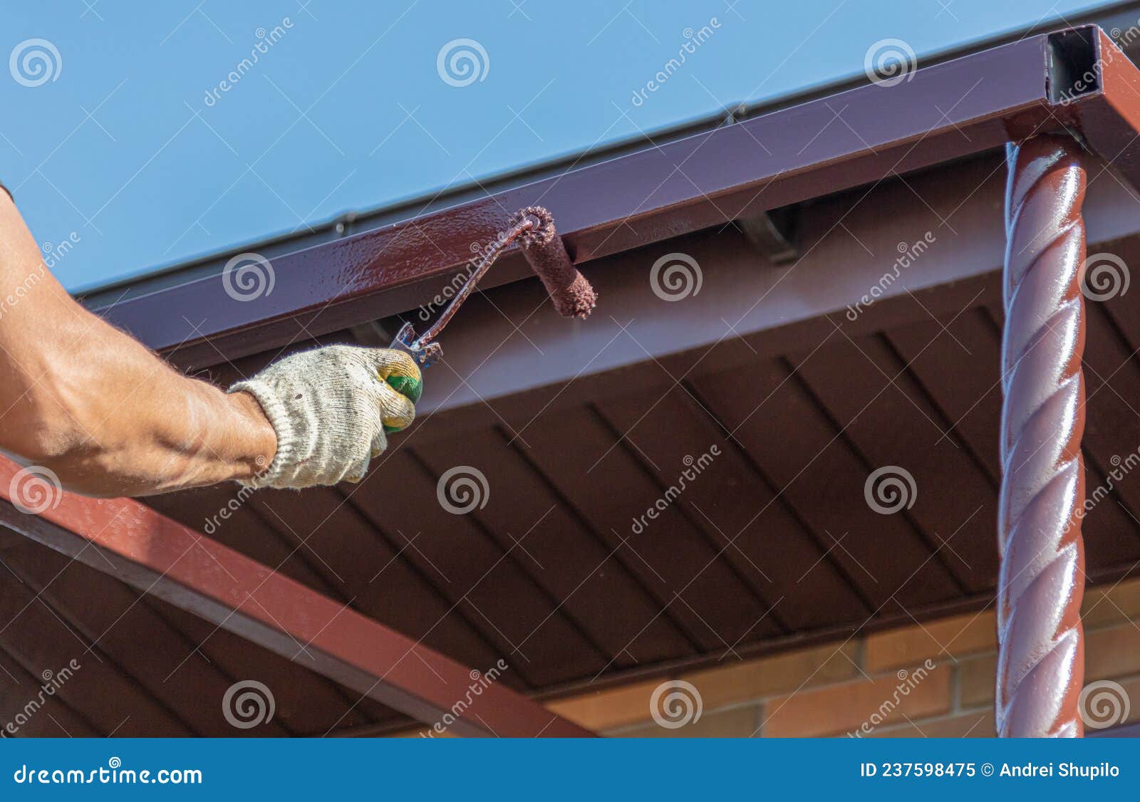 A Worker Paints a Metal Ceiling Stock Image - Image of board ...