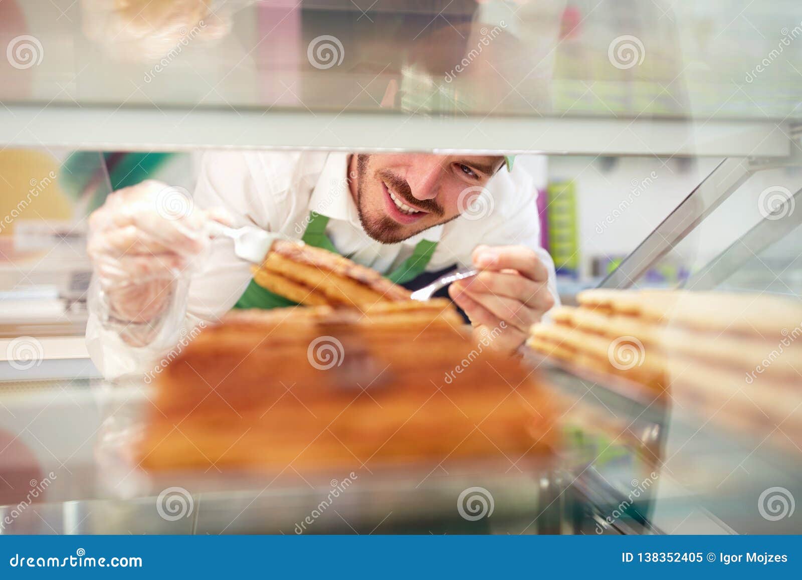 Worker in Pastry Shop Taking Piece of Cake Stock Image - Image of ...