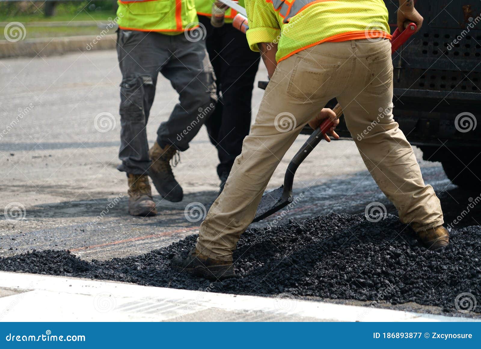 Worker Paving the Road with Asphalt Stock Image - Image of ...