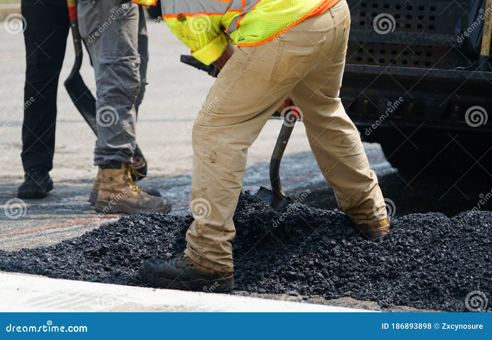 Worker Paving the Road with Asphalt Stock Photo - Image of paving ...