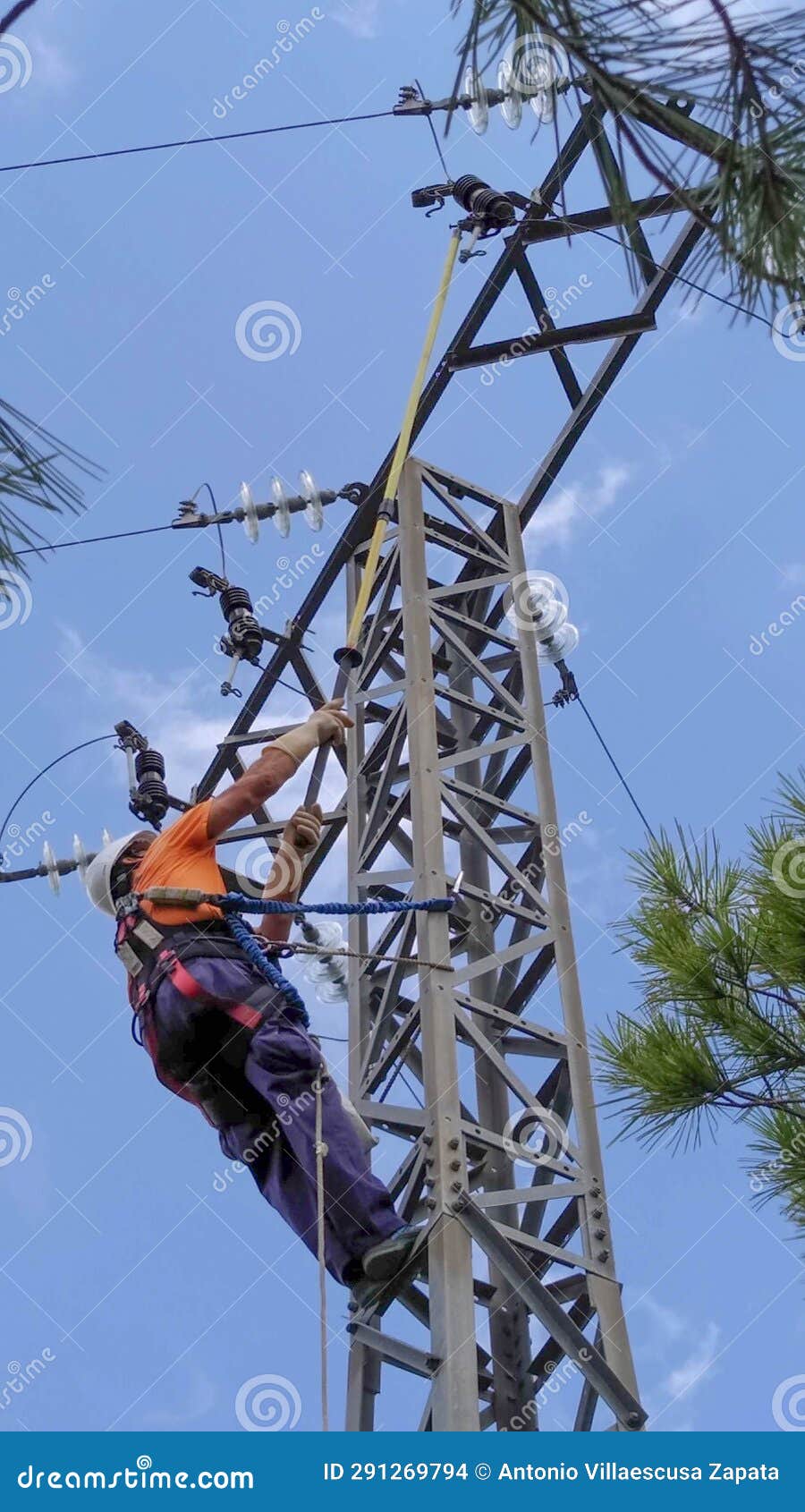 Worker Performing Repairs on a High-voltage Pylon Stock Photo - Image ...