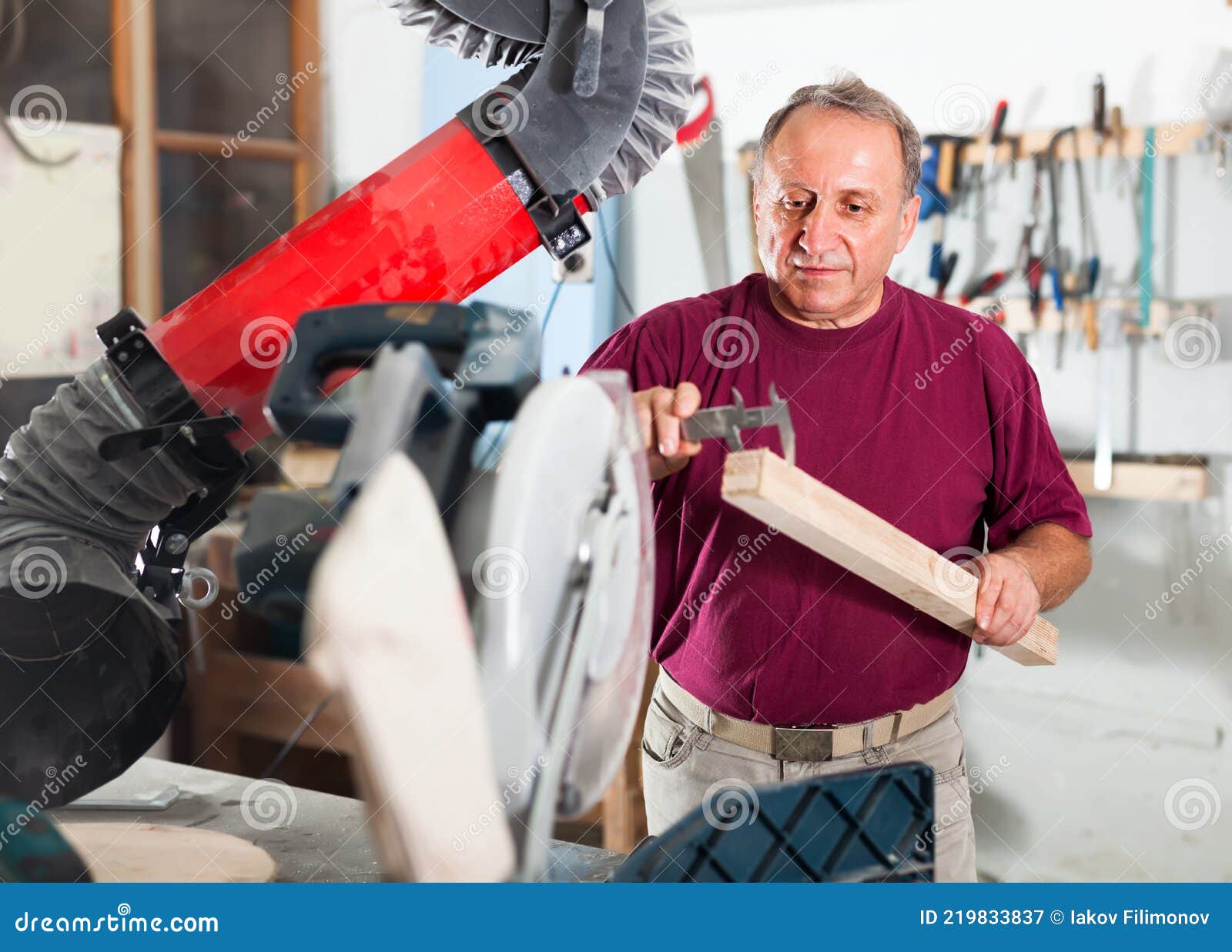 Worker Performs Measurements on Wooden Workpiece with Caliper. Stock ...