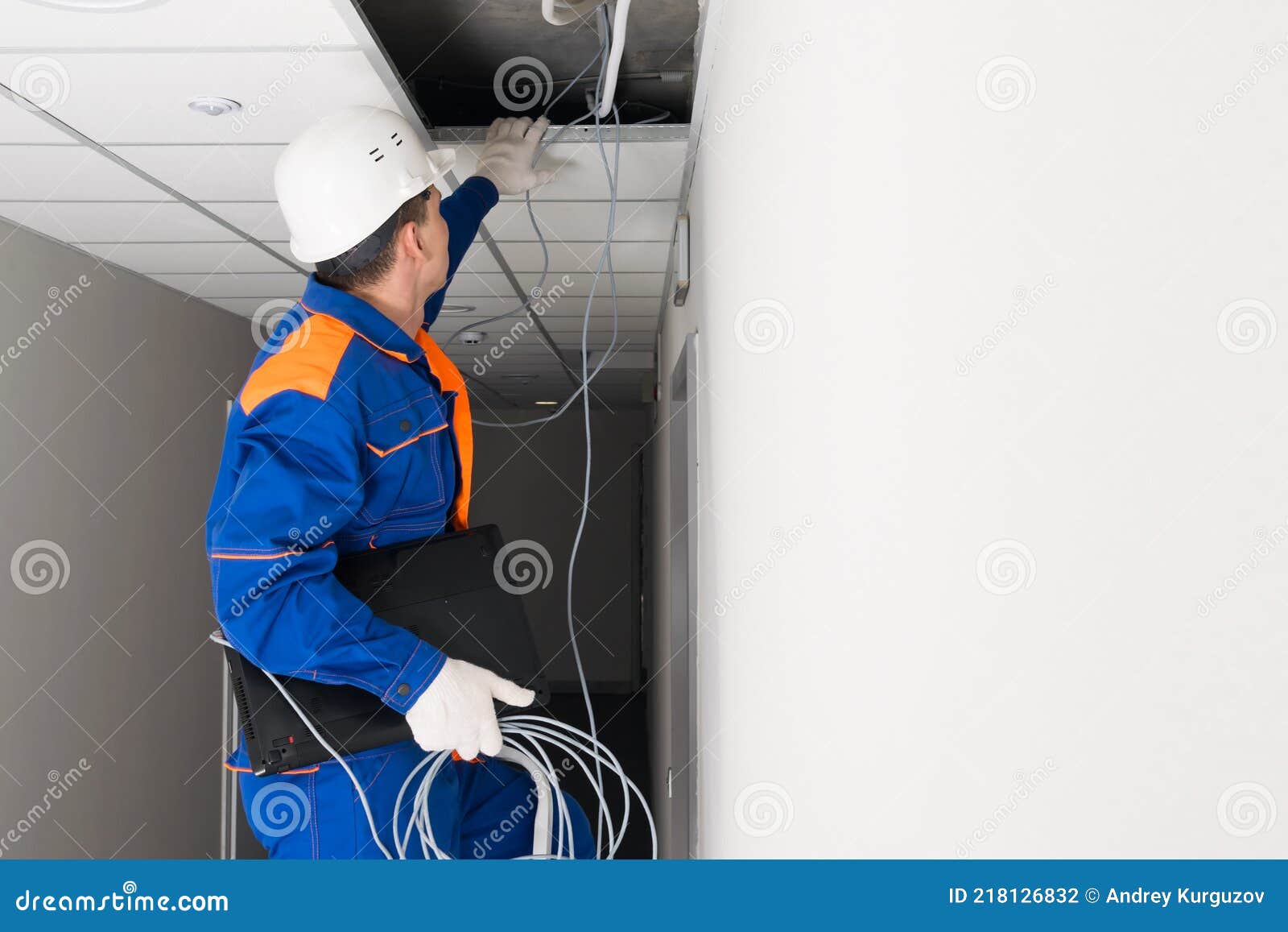 A Worker Performs Technical Work on Setting Up the Internet in Homes ...
