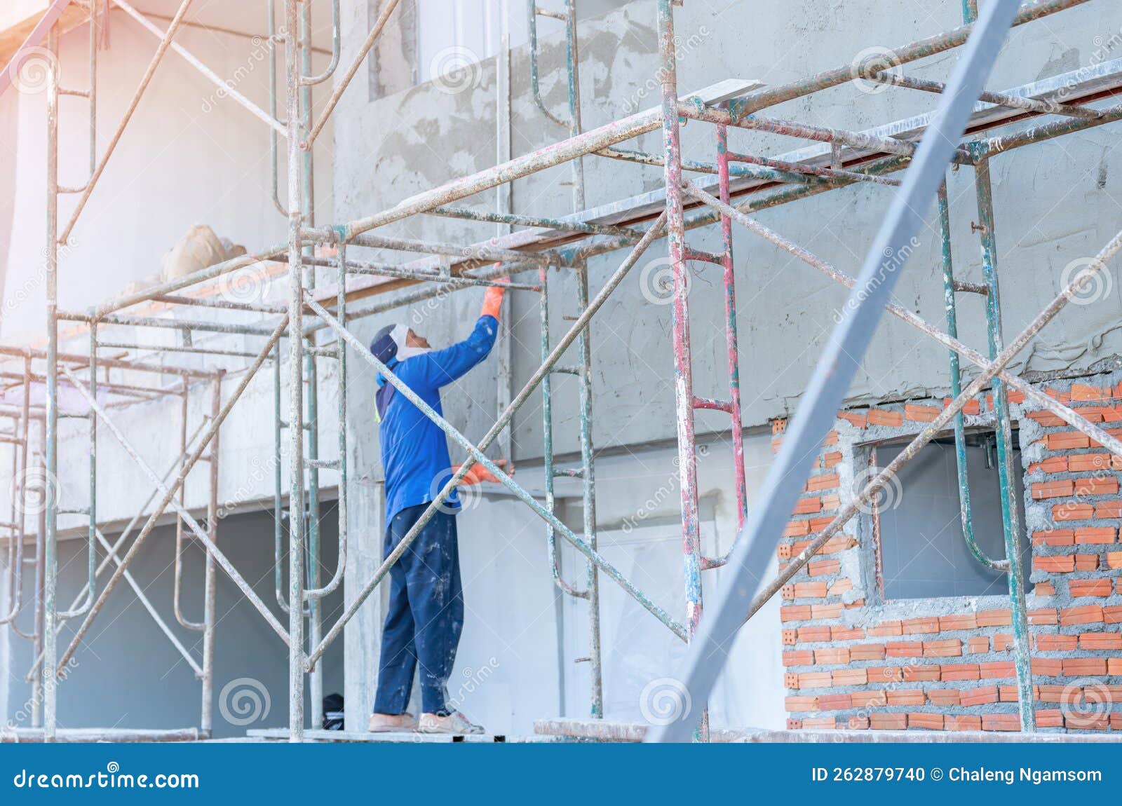 Worker with Plastering Tools Create. Builder Worker Plastering Facade ...
