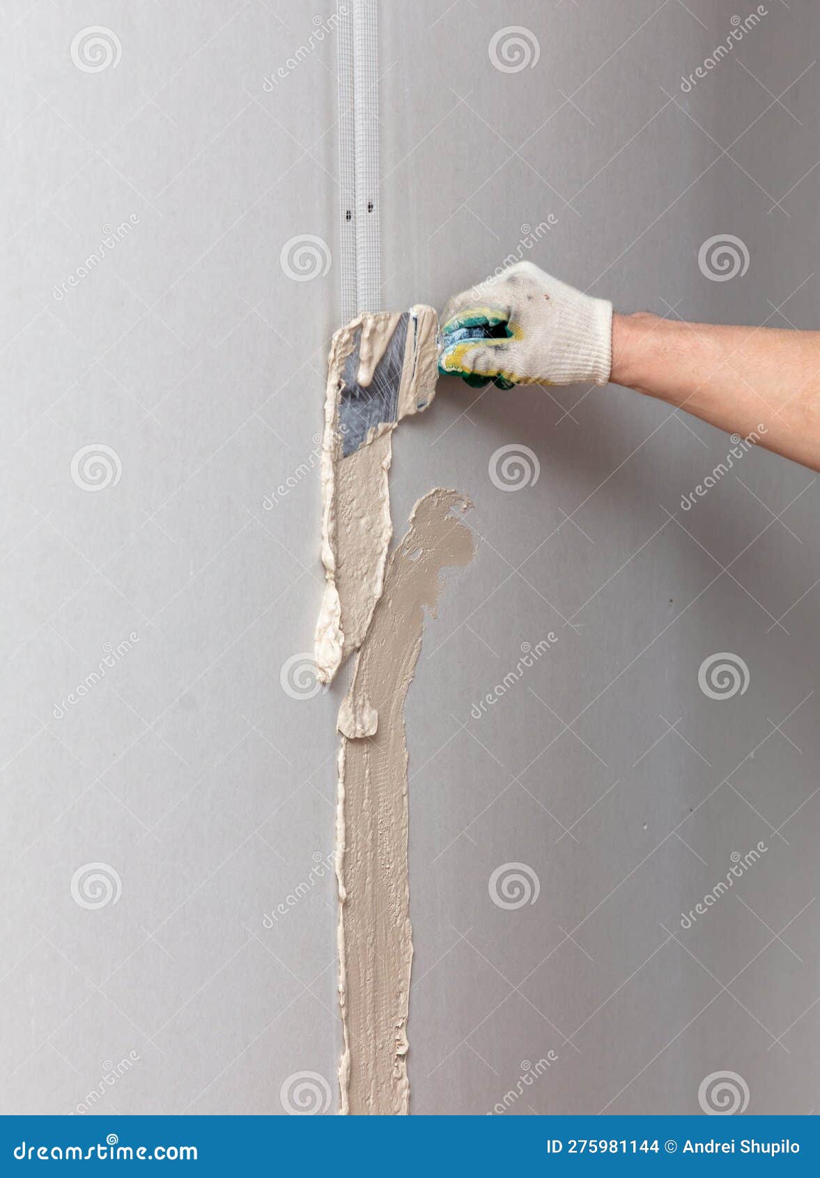 A Worker is Plastering a Wall with a Plastering Tool. Stock Photo ...