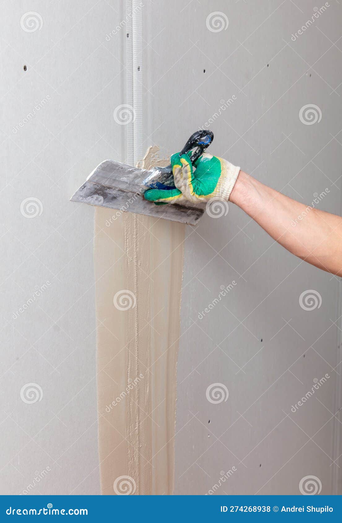 A Worker is Plastering a Wall with a Plastering Tool. Stock Photo ...