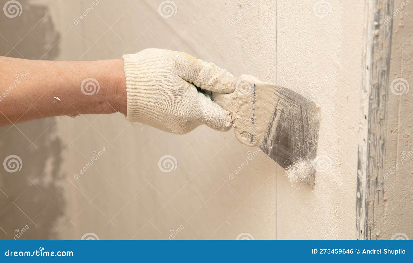 A Worker is Plastering the Walls of a House Under Construction Stock ...