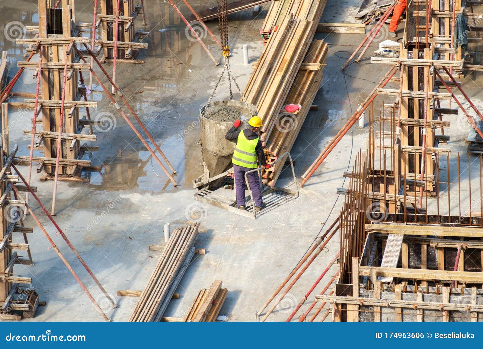 Worker on the Platform with Concrete Hang on Chain Stock Photo - Image ...