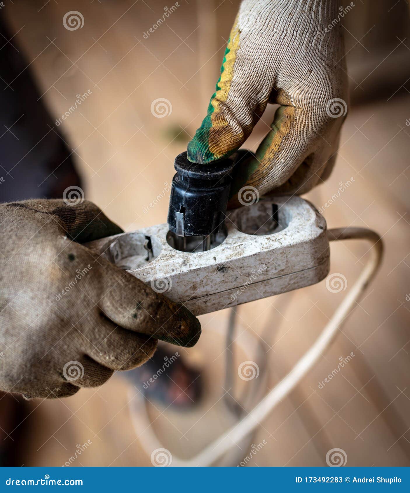 The Worker Plugs the Tool into a Power Outlet Stock Image - Image of ...