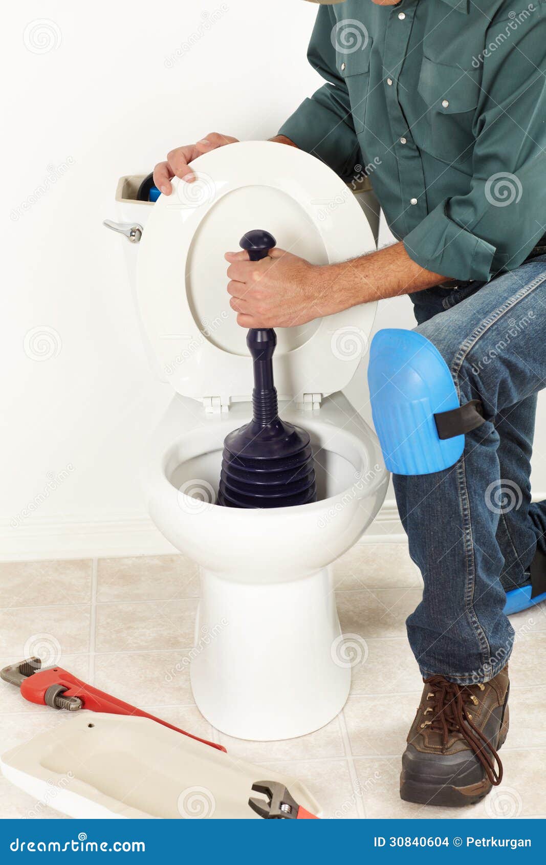 The worker with a plunger stock photo. Image of janitor - 30840604