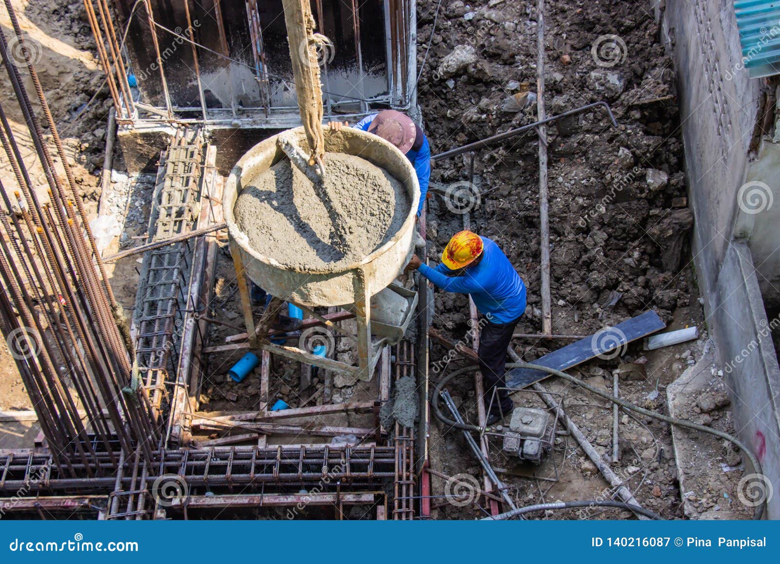 Worker Pouring Cement Pouring Into Foundations And Pillars Formwork At ... Worker Pouring Cement Pouring Into Foundations And Pillars Formwork At ...