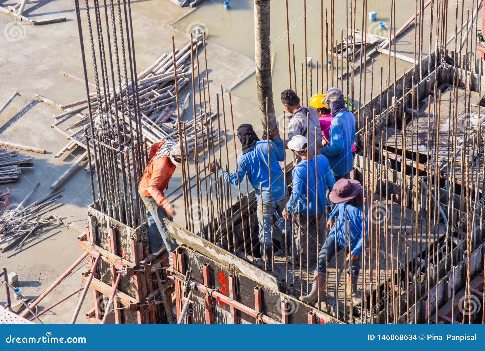 Worker Pouring Cement Pouring into Foundations and Pillars Formwork at ...