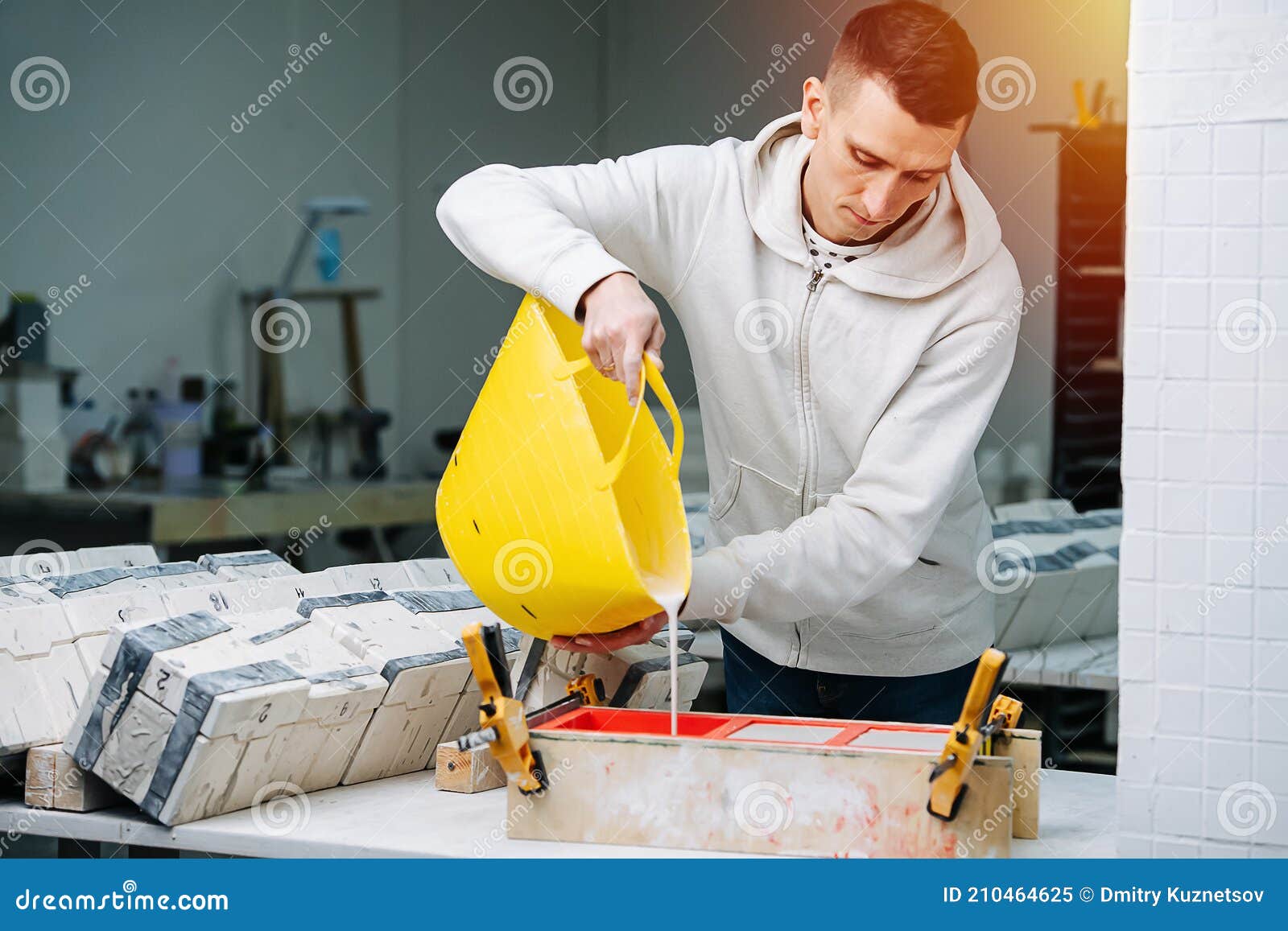 Worker Pouring Gypsum Plaster in Open Form for Mold Casting for Making ...