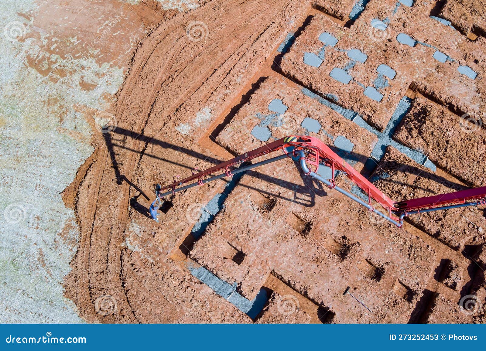A Worker Pours Concrete into the House Foundation Using a Concrete Pump ... A Worker Pours Concrete into the House Foundation Using a Concrete Pump ...