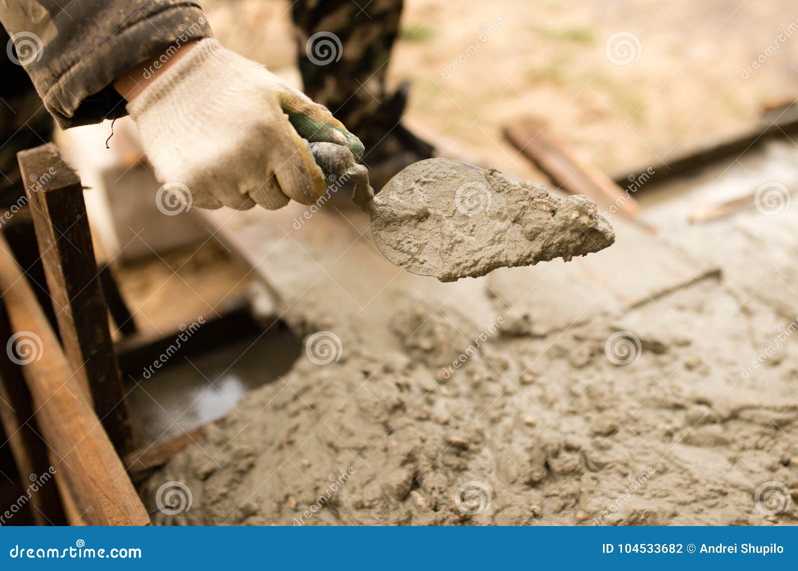 Worker Pours Concrete Mortar on a Construction Site Stock Photo - Image ... Worker Pours Concrete Mortar on a Construction Site Stock Photo - Image ...