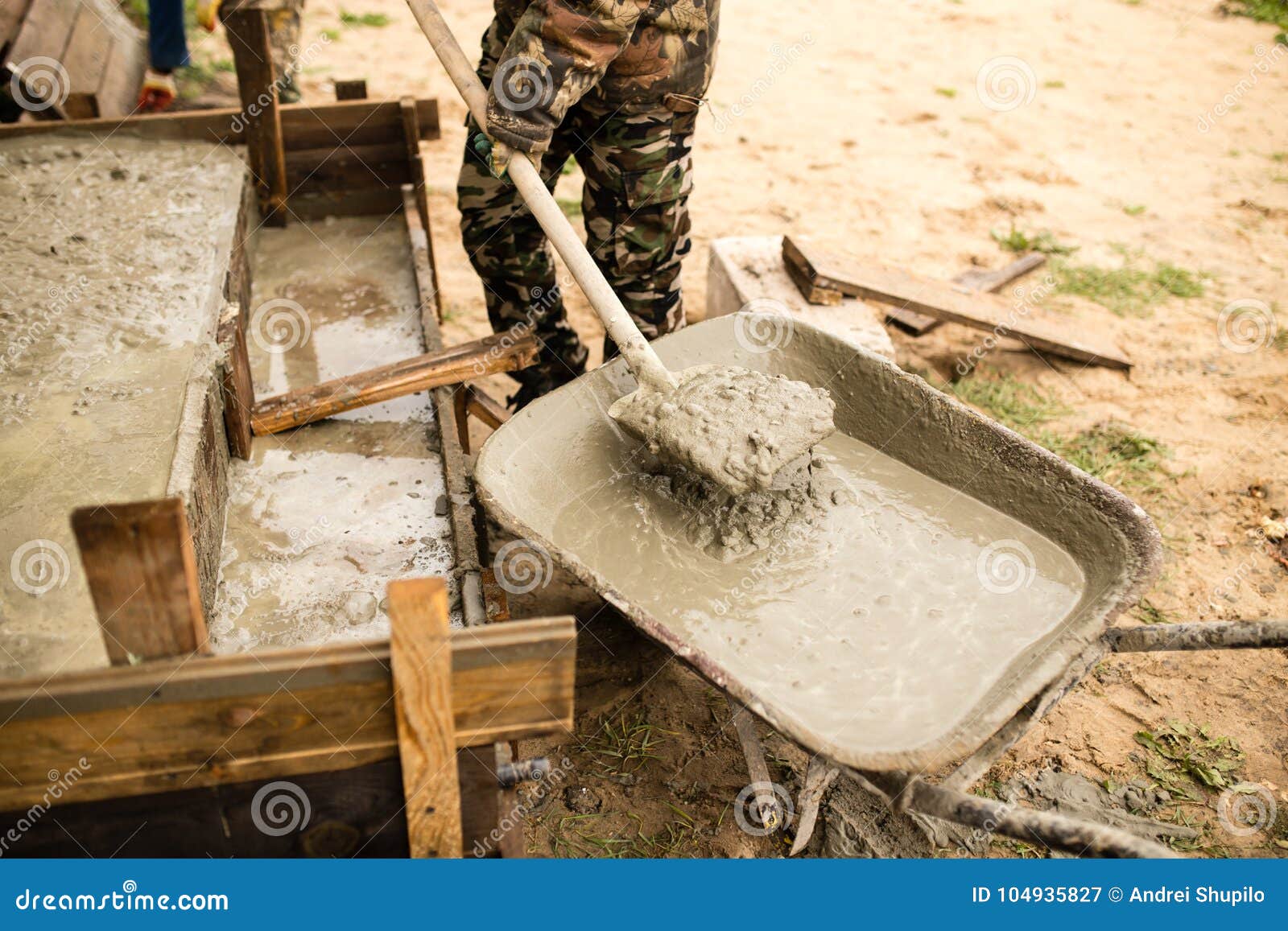 Worker Pours Concrete Mortar on a Construction Site Stock Image - Image ... Worker Pours Concrete Mortar on a Construction Site Stock Image - Image ...