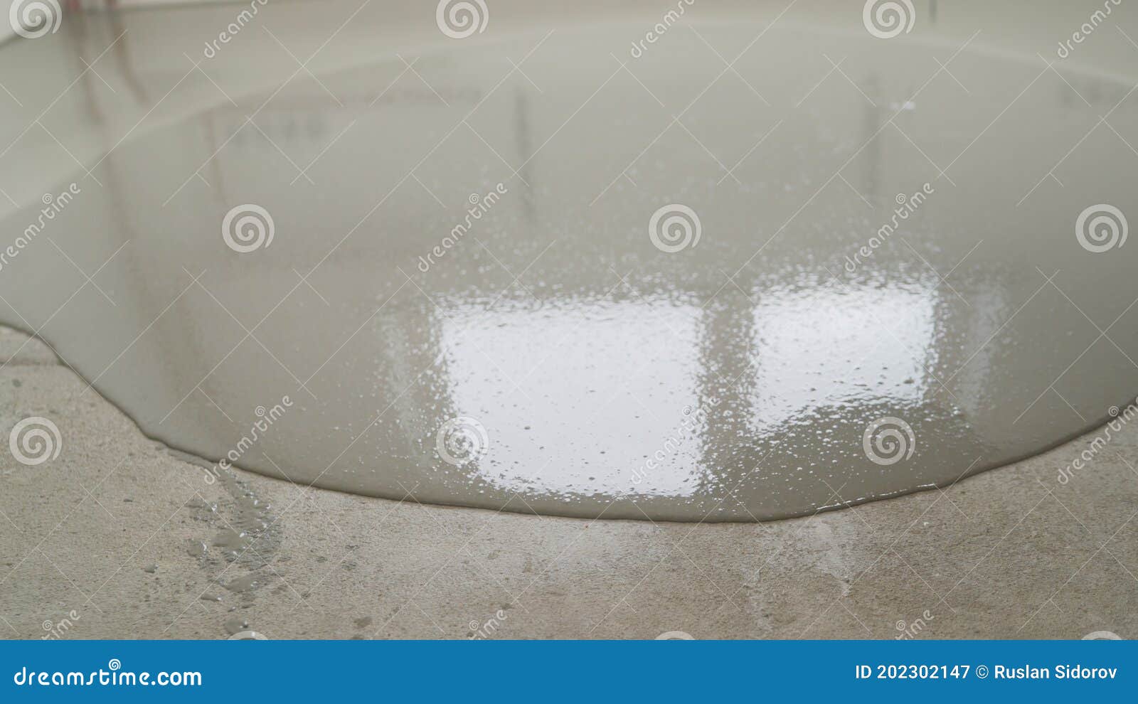 Leveling The Floor With A Long Spatula. Builder Levels A Laid Floor ...