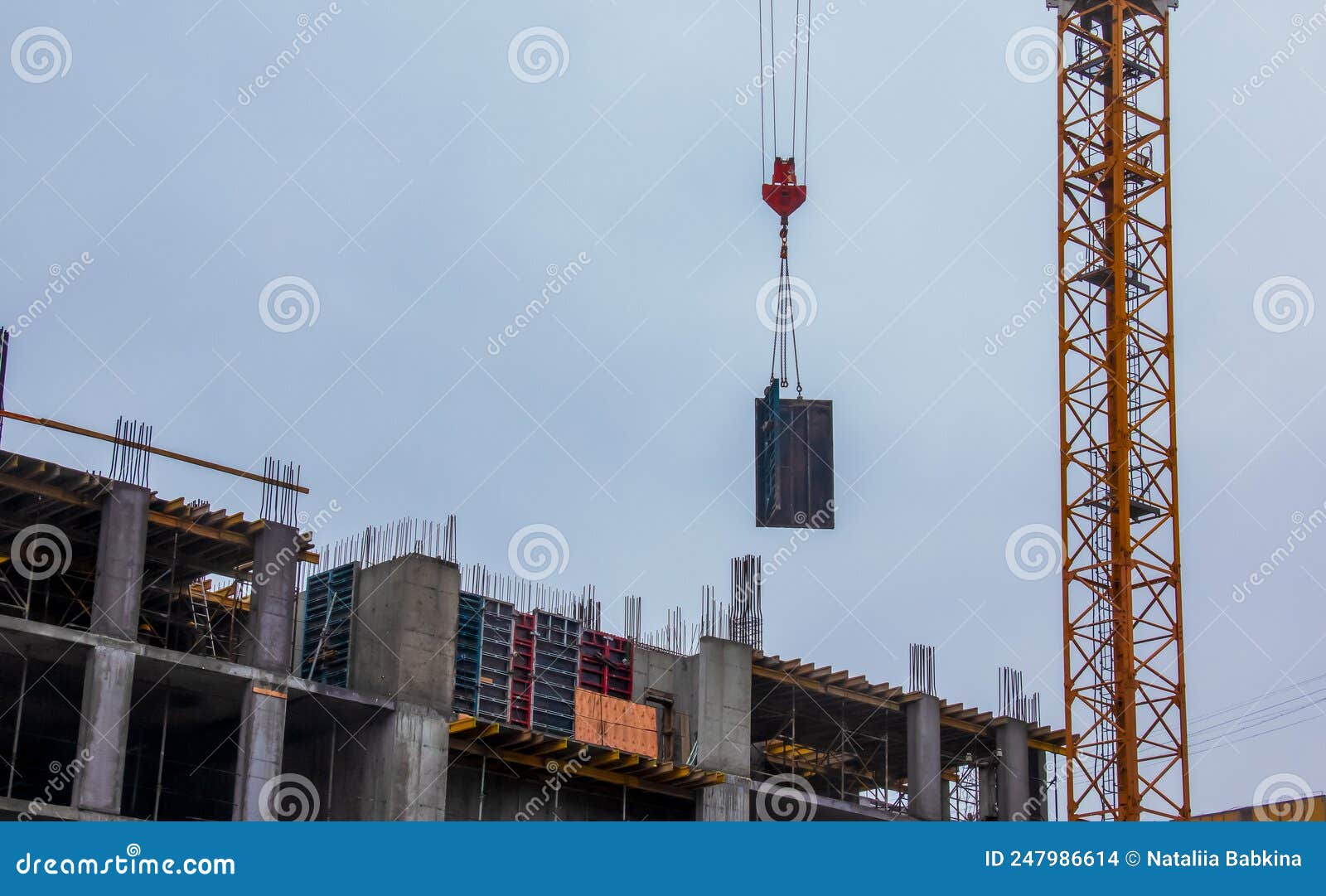 A Worker Prepares Formwork for a Modern Metal-concrete Structure of a ...