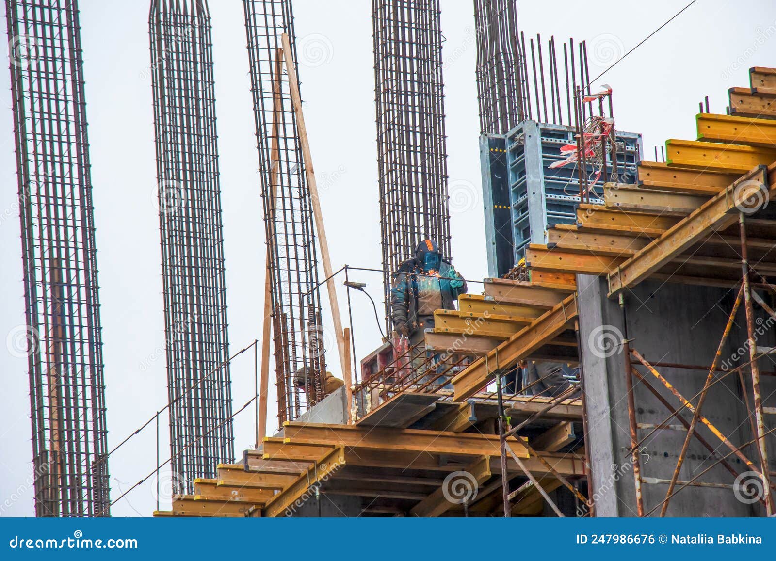 A Worker Prepares Formwork for a Modern Metal-concrete Structure of a ...
