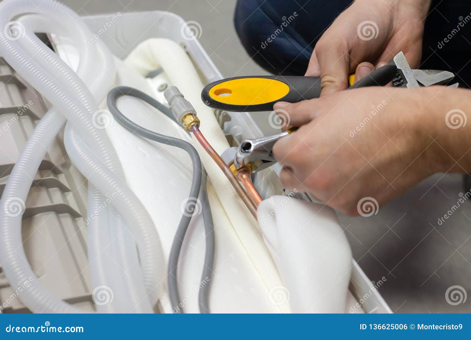 The Worker is Preparing To Install the Air Conditioner. Tools for ...