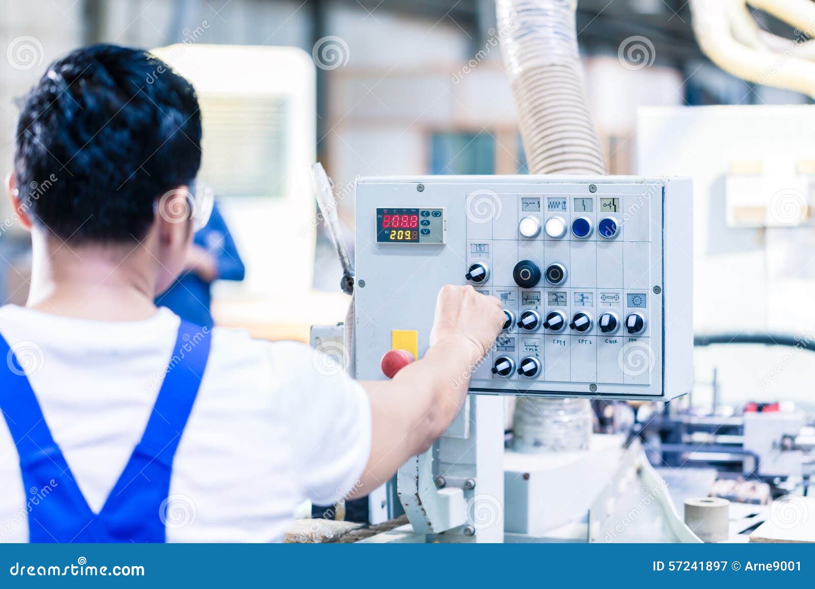 Worker Pressing Buttons on CNC Machine in Factory Stock Image - Image ...