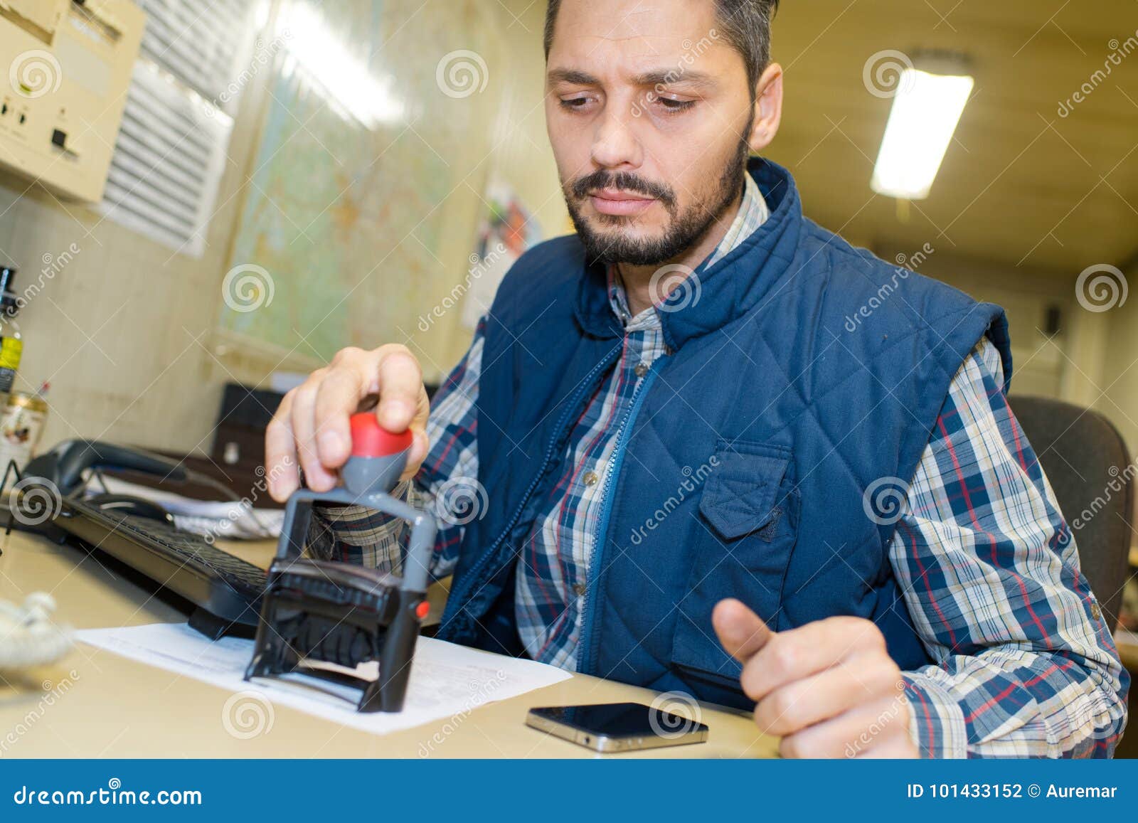 Worker Pressing Stamp on Document in Office Stock Photo - Image of ...