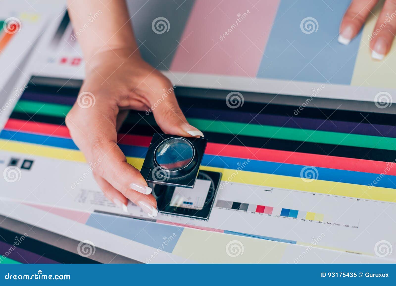 Worker in Printing and Press Centar Uses a Magnifying Glass Stock Photo ...
