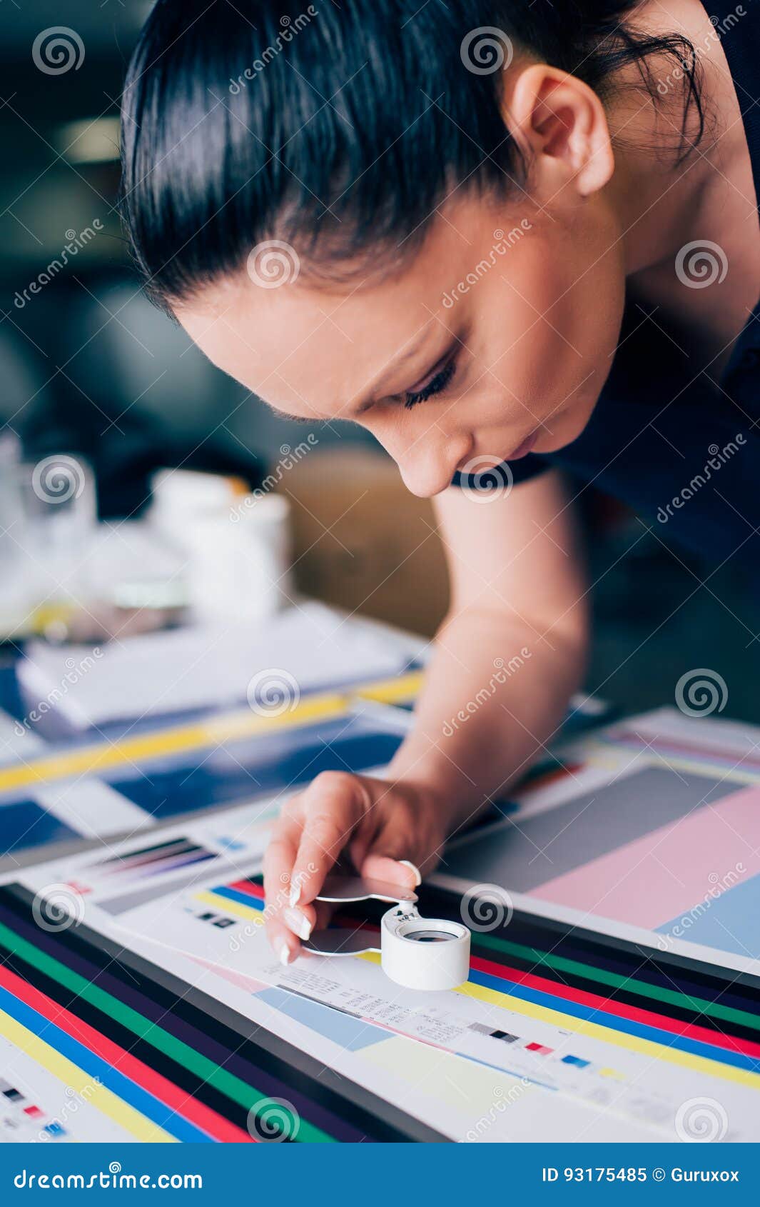 Worker in Printing and Press Centar Uses a Magnifying Glass Stock Image ...
