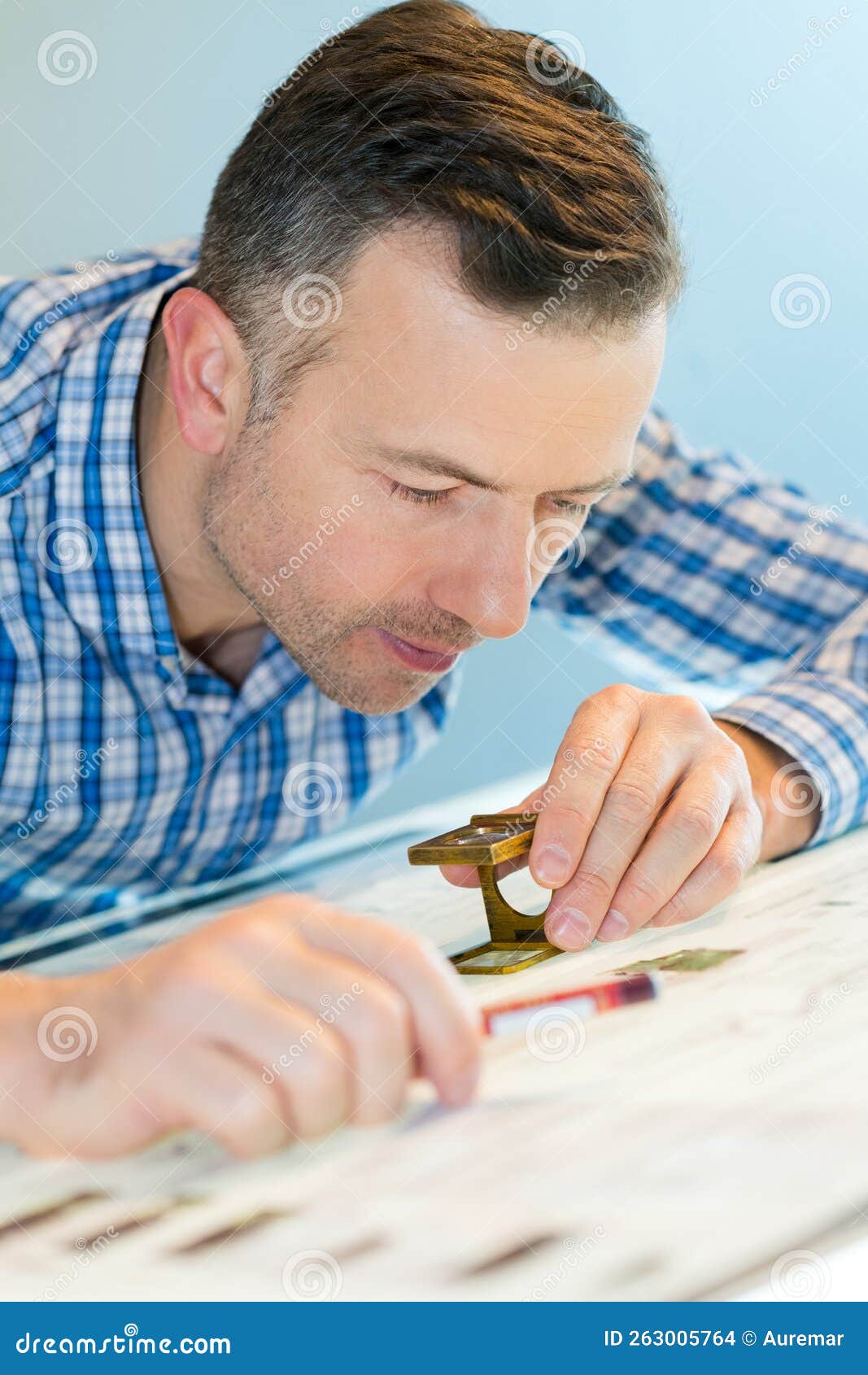 Worker in Printing and Press Center Using Magnifying Glass Stock Photo ...