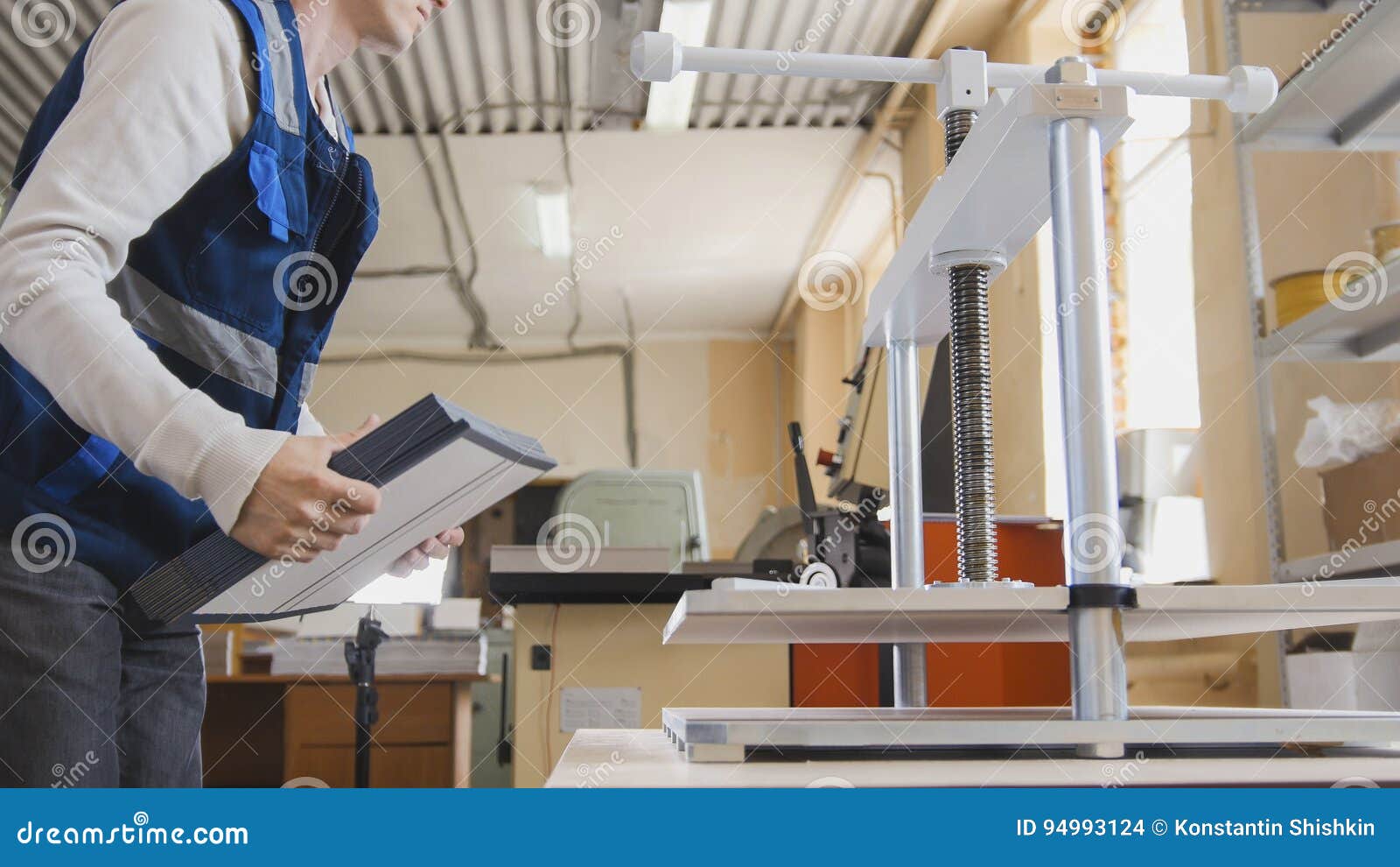 Worker of Printing with a Stack of Paper at the Machine Stock Photo ...