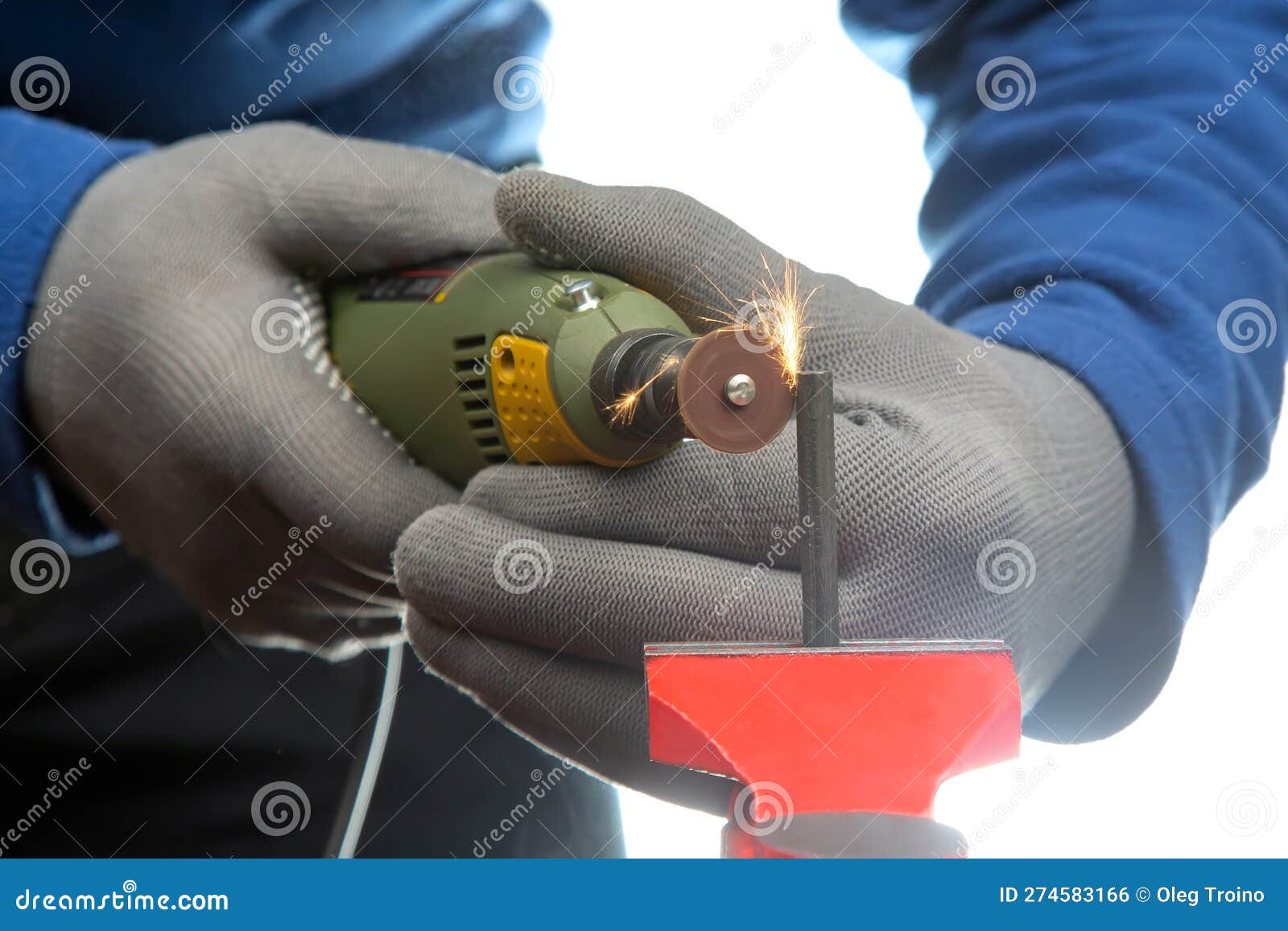 Worker Processes Metal with Engraving Drill Close-up. the Work of the ...