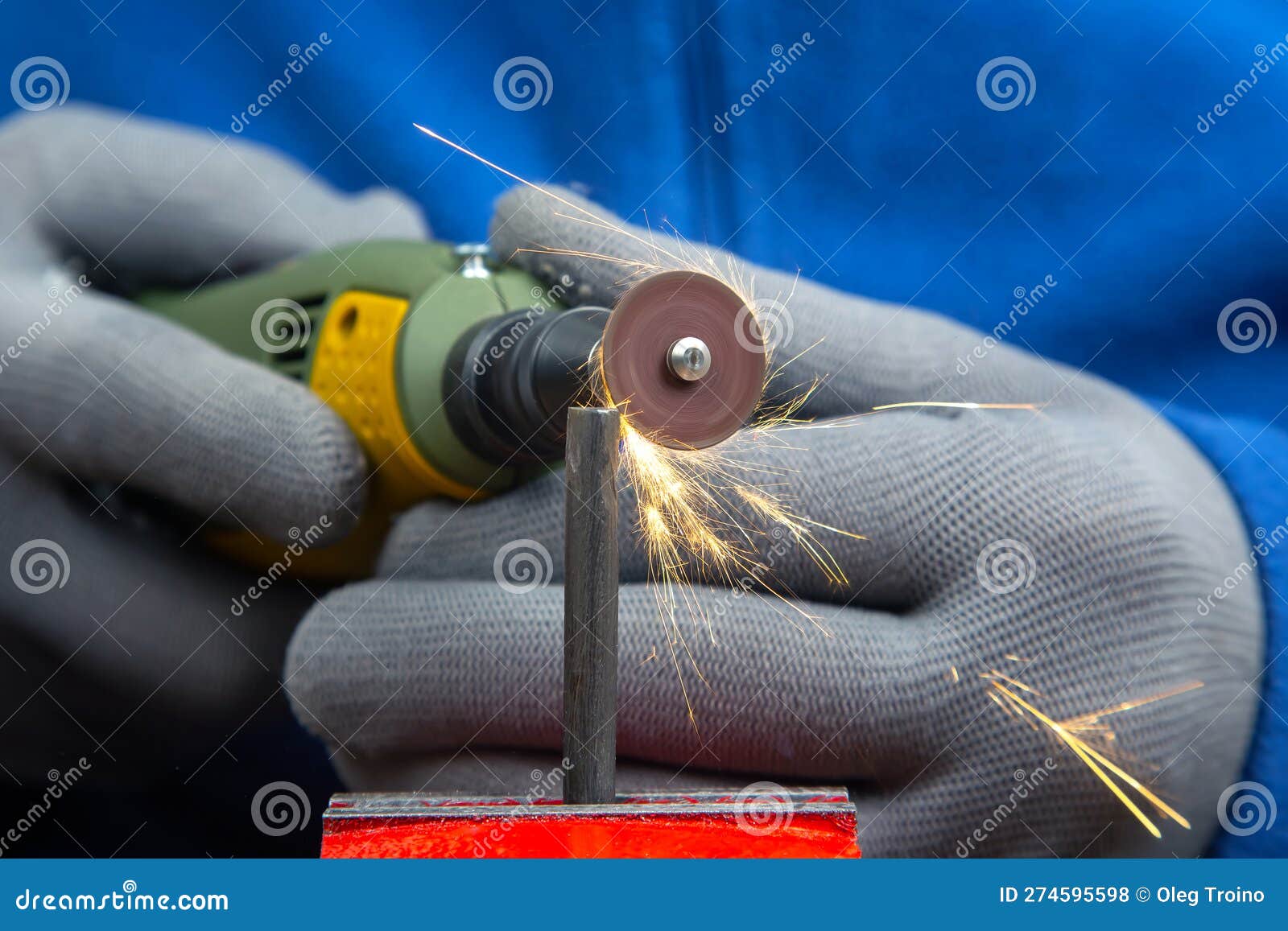 Worker Processes Metal with Engraving Drill Close-up. the Work of the ...