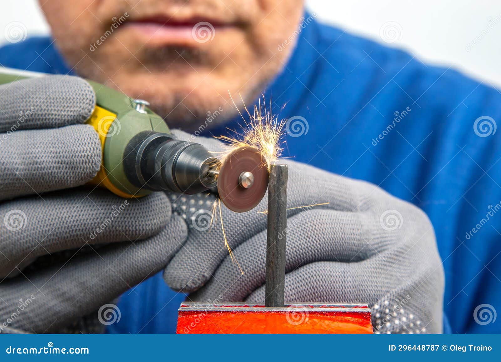 Worker Processes Metal with Engraving Drill Close-up. the Work of the ...