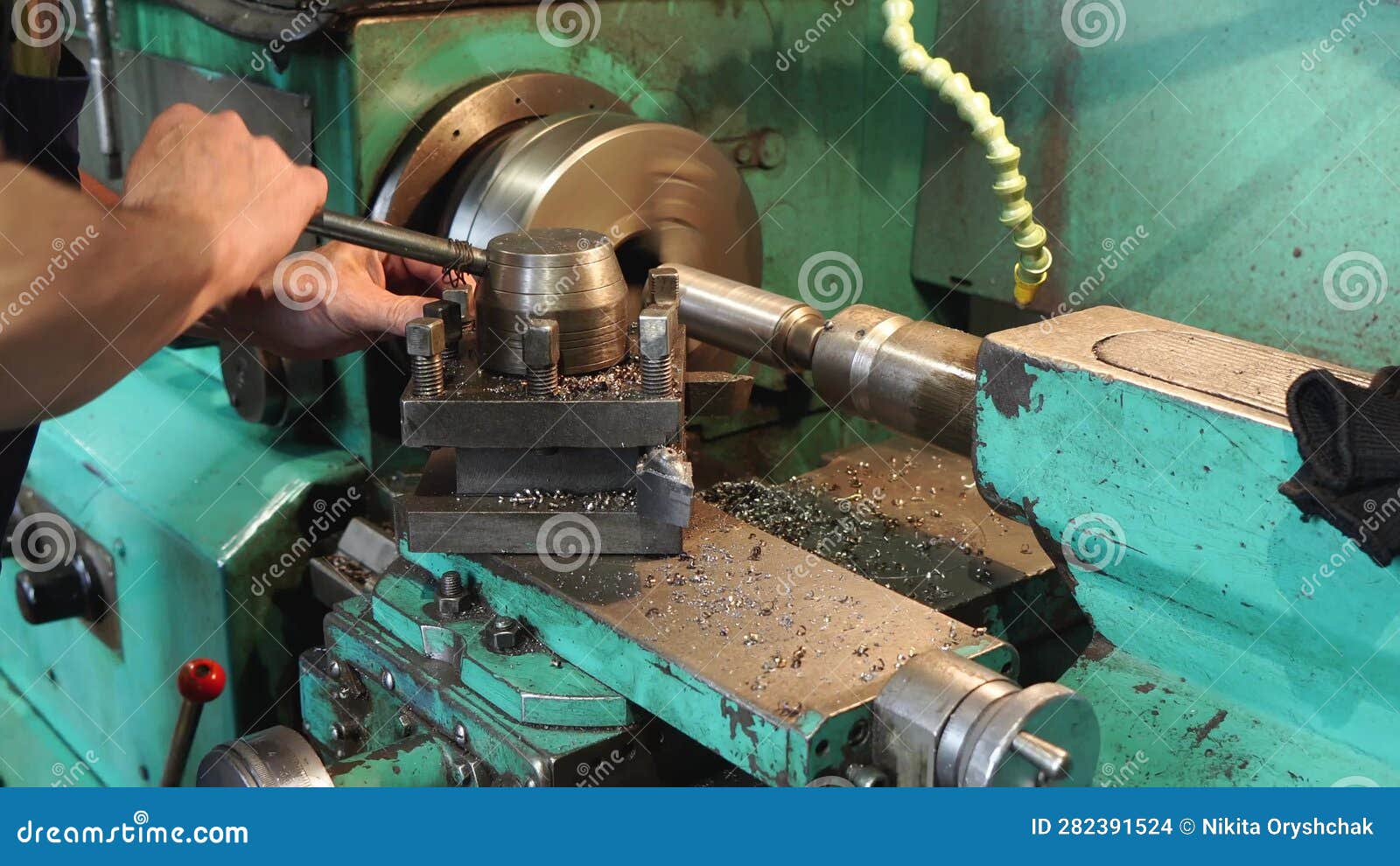 A Worker Processes a Metal Workpiece on a Milling Machine. Factory ...