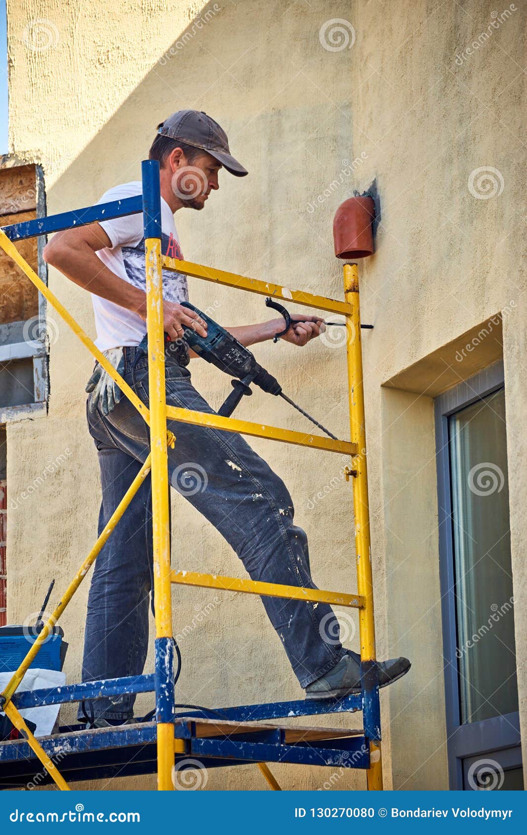 Builder at the Finish House Working with the Tool. Stock Photo - Image ...