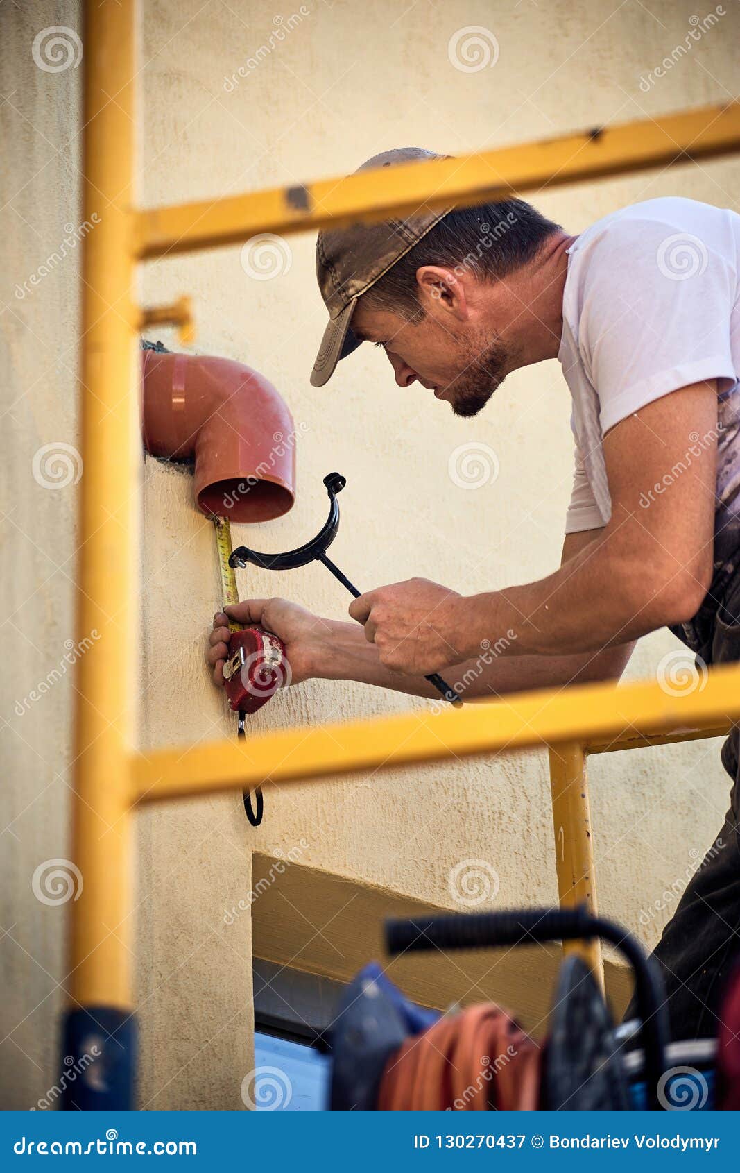 Builder at the Finish House Working with the Tool. Stock Image - Image ...