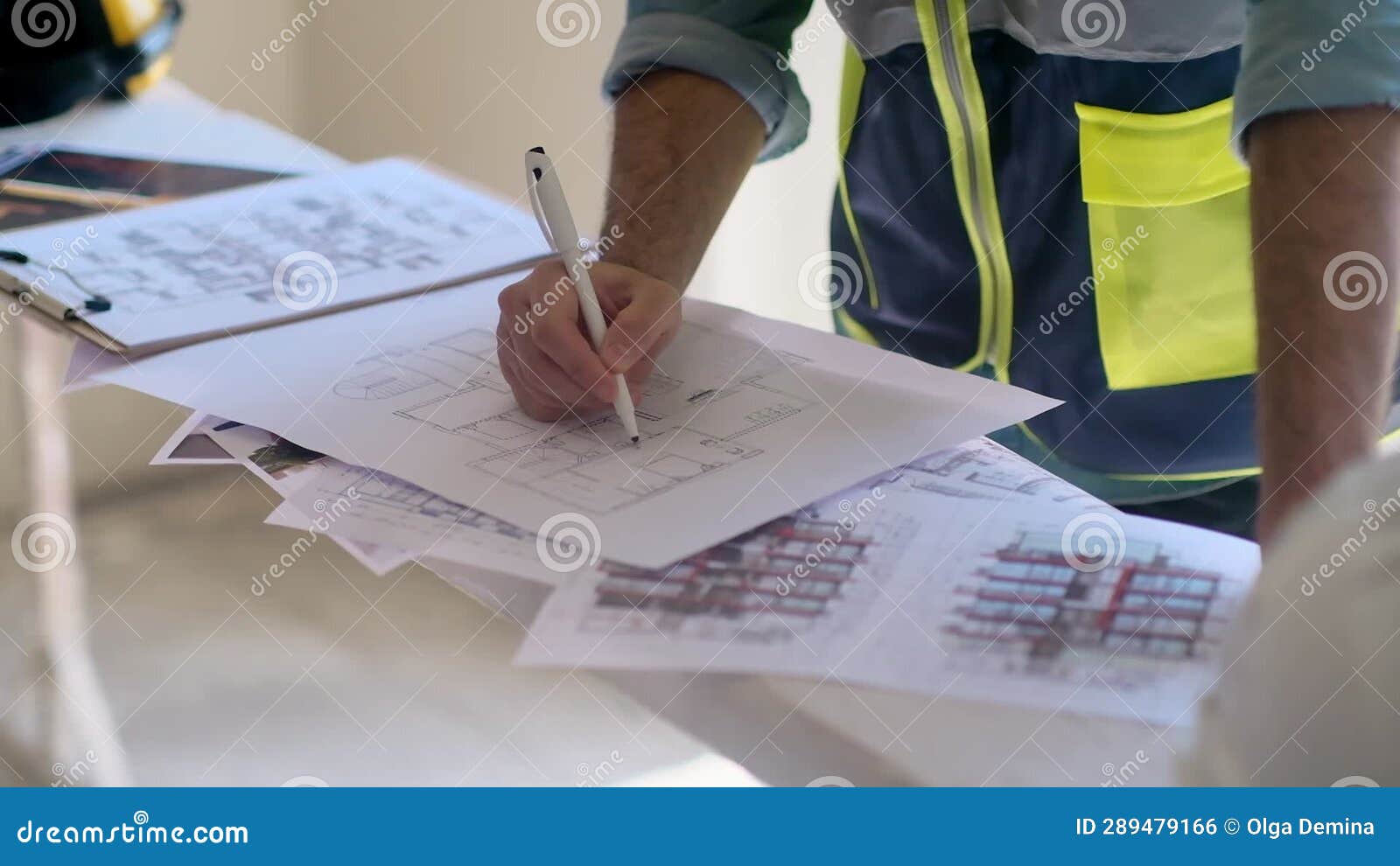 Worker in Professional Uniform Editing and Correcting Construction ...