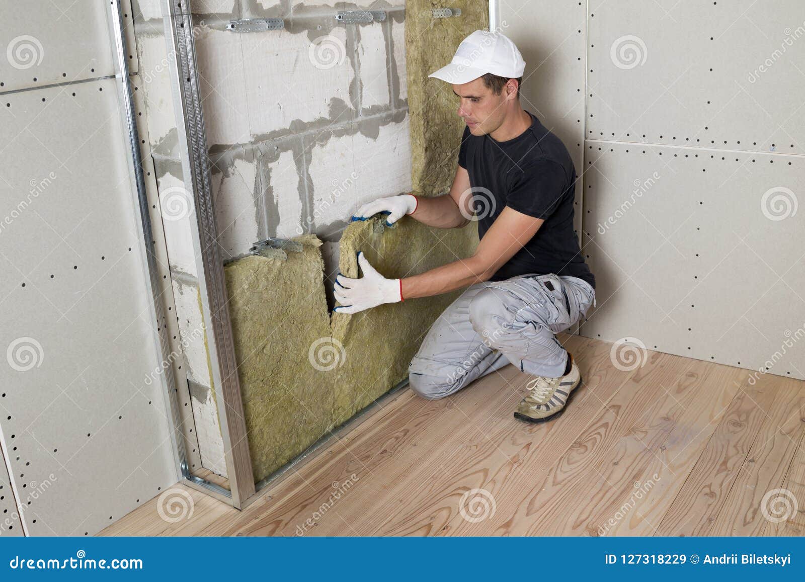 Worker in Protective Gloves Insulating Rock Wool Insulation in W Stock ...